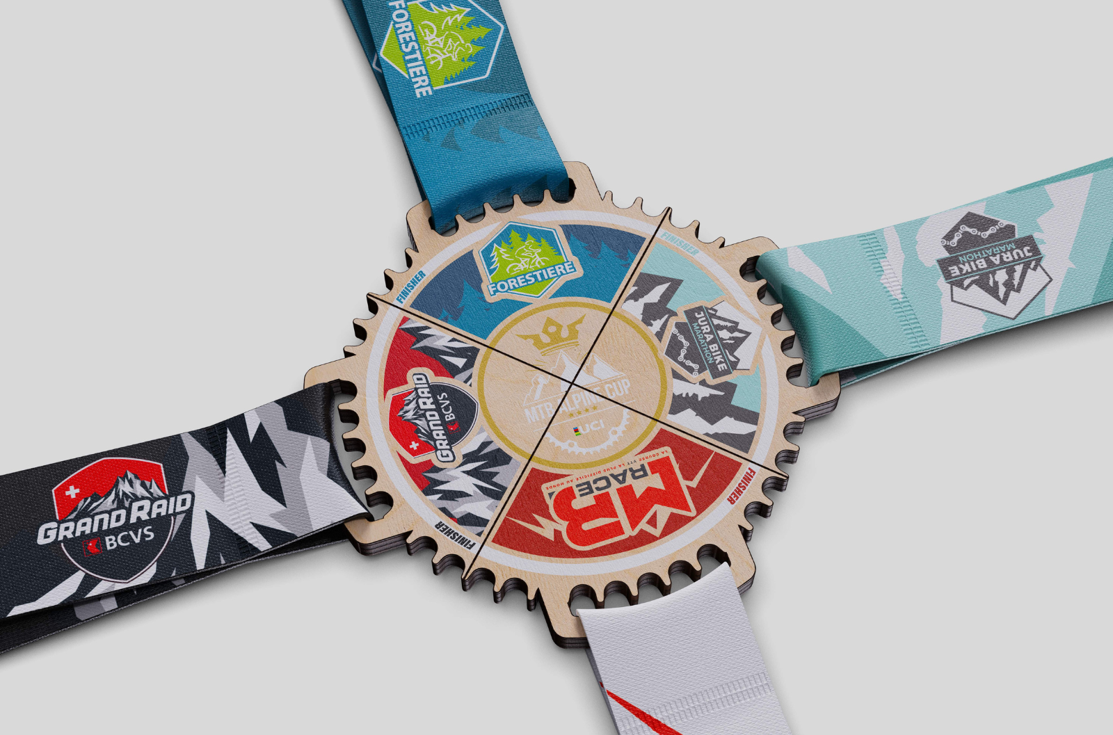 Finishers' medals tell the story of the MTB Alpine Cup adventure!